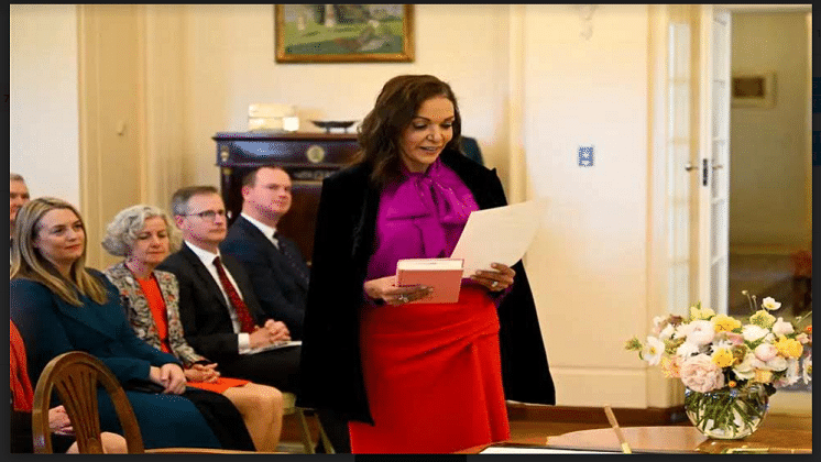 Australia's first Muslim minister, Anne Ali, takes oath with her hands ...